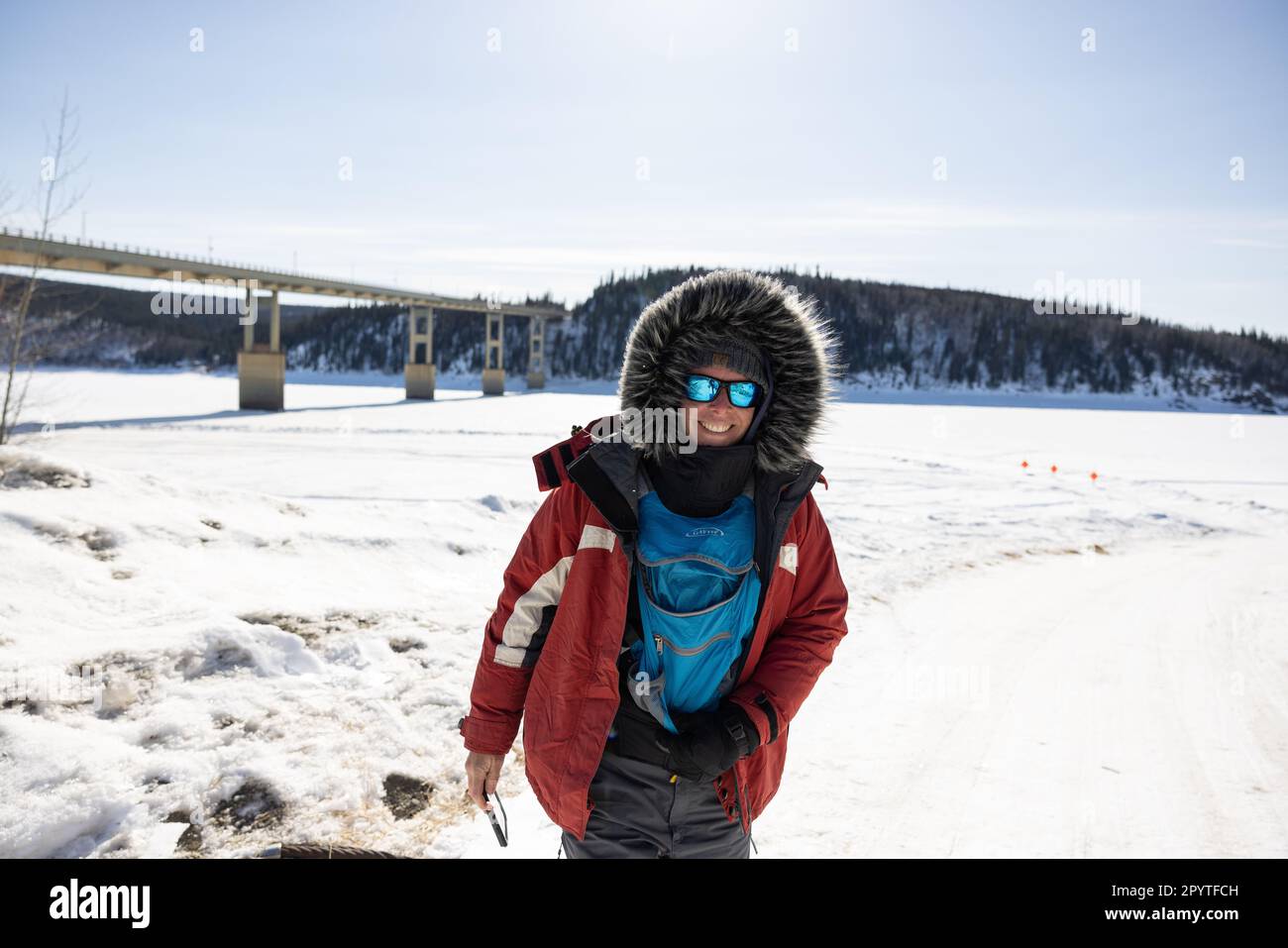 Woman standing on the frozen Yukon River in Alaska Stock Photo - Alamy