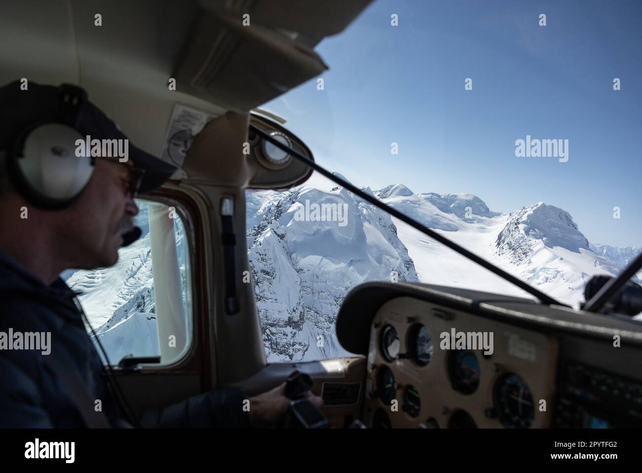 Pilot flying plane over Mountain Denali in Alaska Stock Photo - Alamy