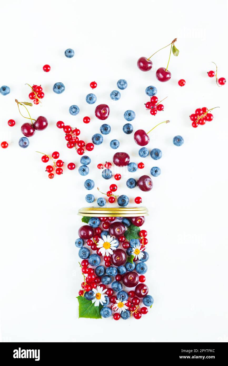 Mix of fresh berries in the form of a jar. Flying berries. Flat lay ...