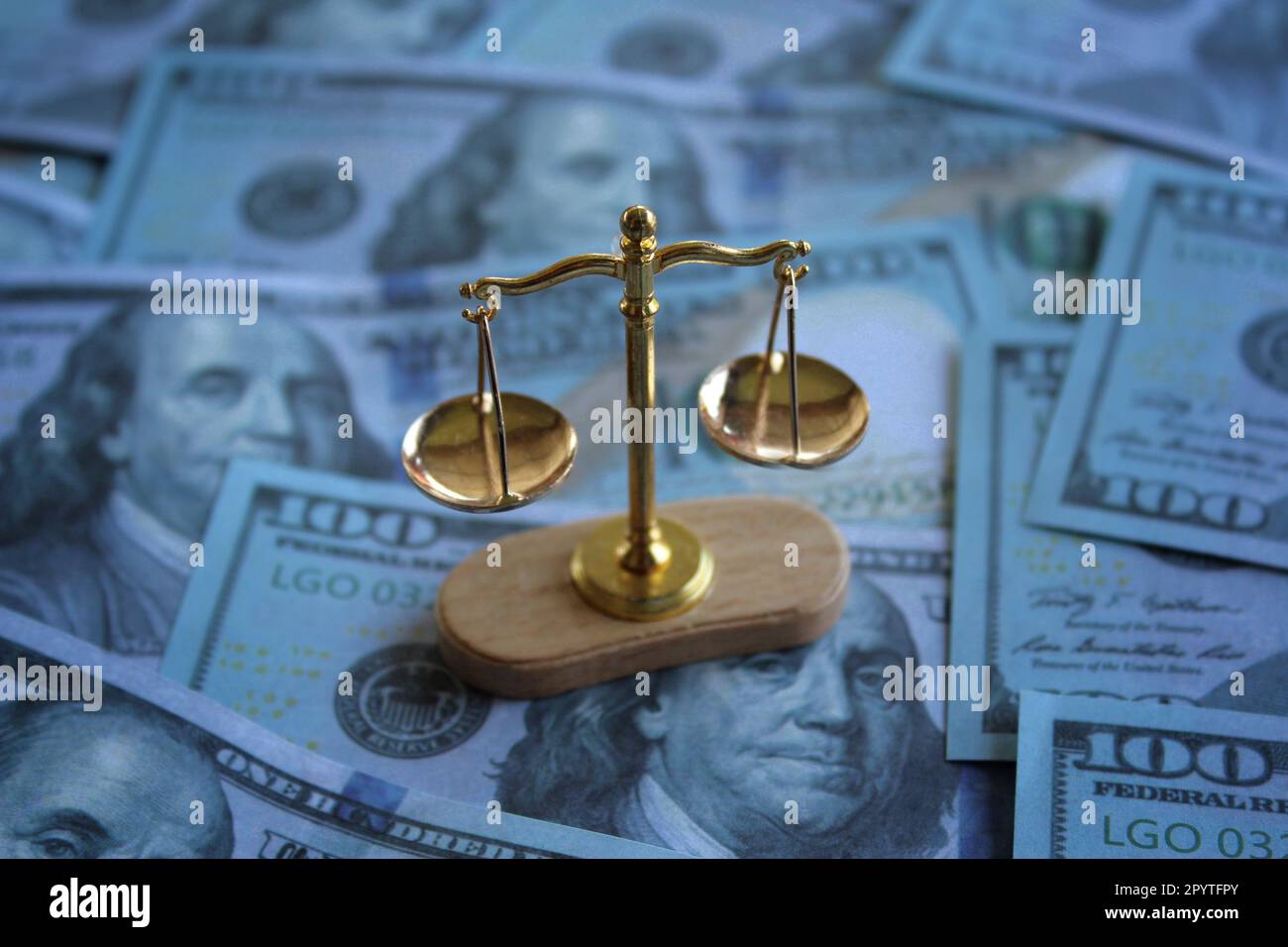 Balancing scale on top of money. Law, bribery, justice and corruption ...