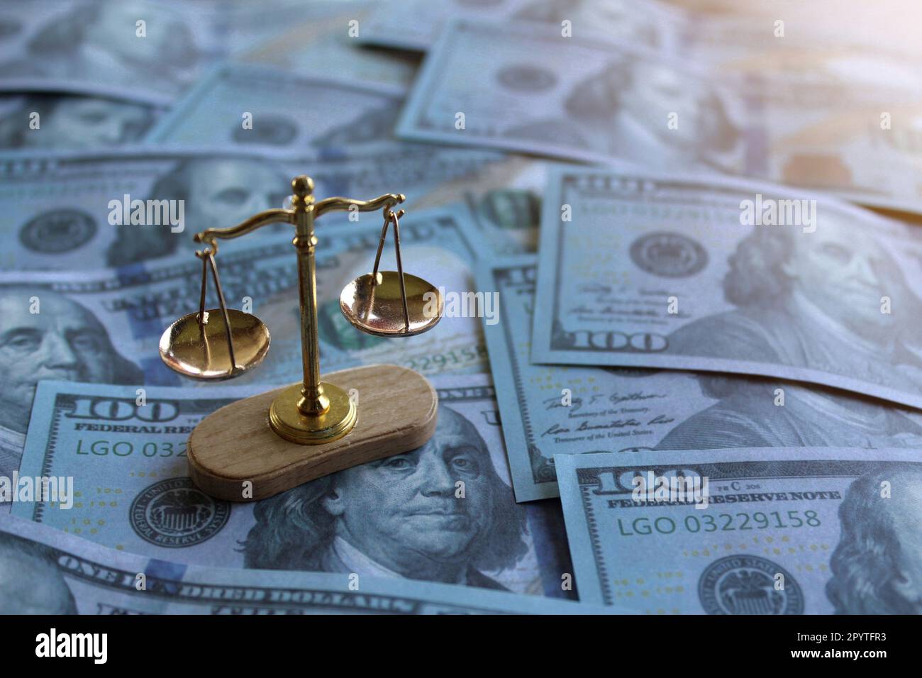Balancing scale on top of money. Law, bribery, justice and corruption ...