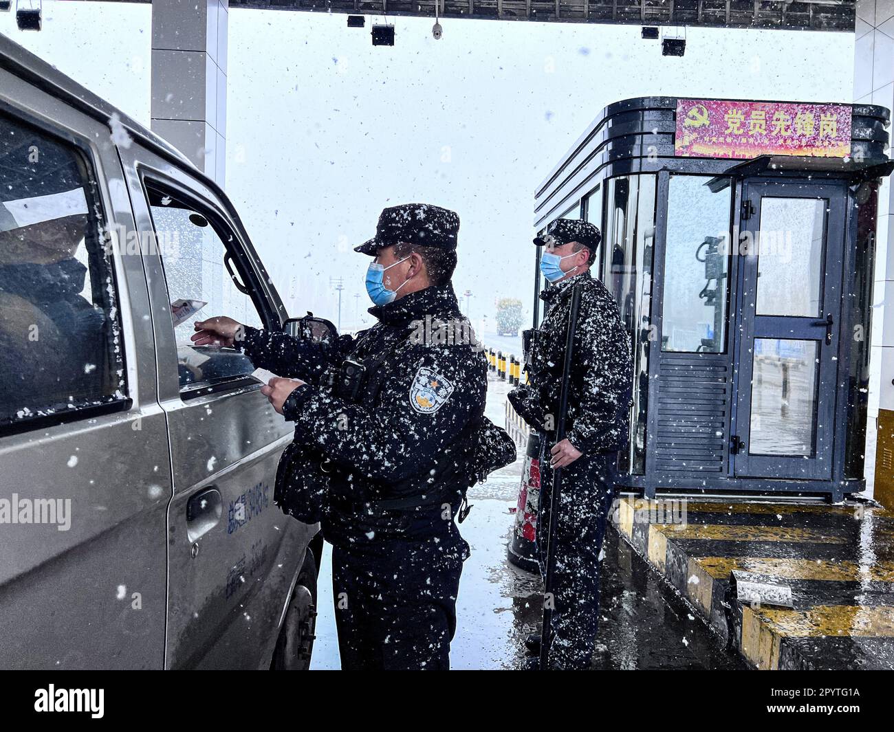 ALTAY, CHINA - MAY 4, 2023 - Police officers check the documents of ...