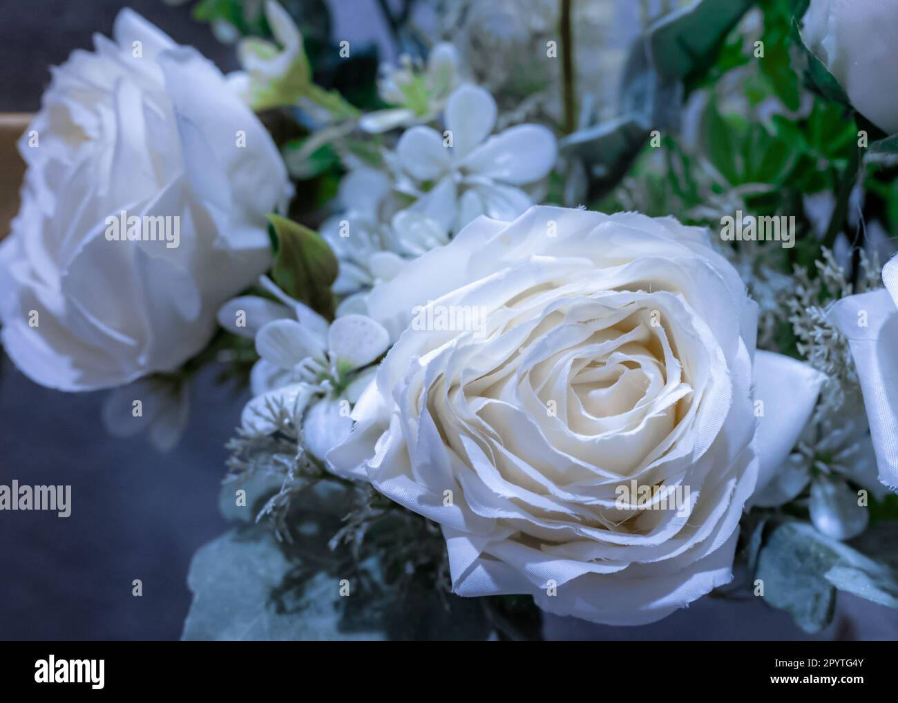 A floral arrangement featuring a selection of white flowers Stock Photo ...