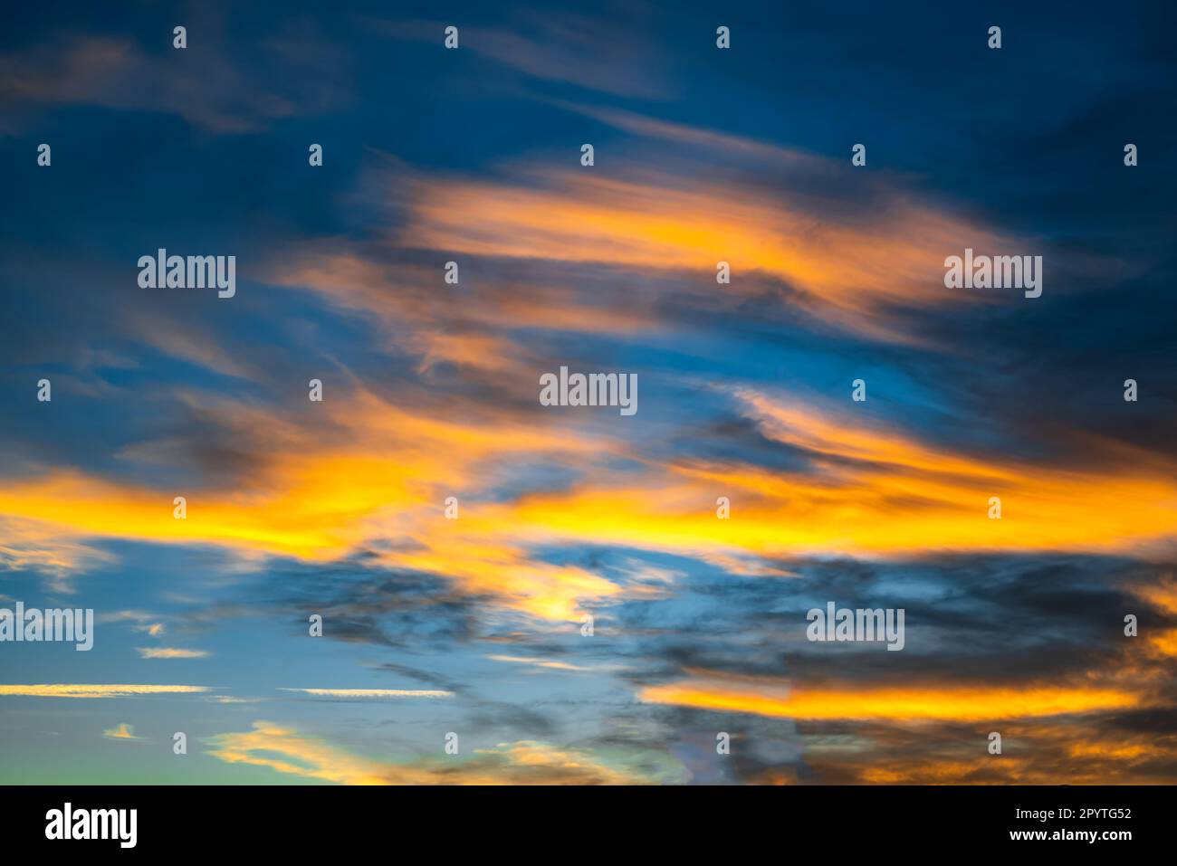 A stunning sunset with a vibrant array of colors in the sky Stock Photo ...