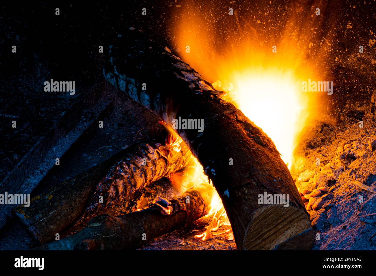 Bonfire with burning logs and flame seen from close up Stock Photo - Alamy