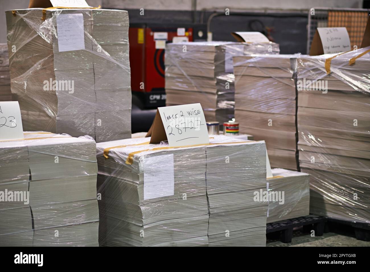 The finished printed product ready for shipment. stacks of printed ...