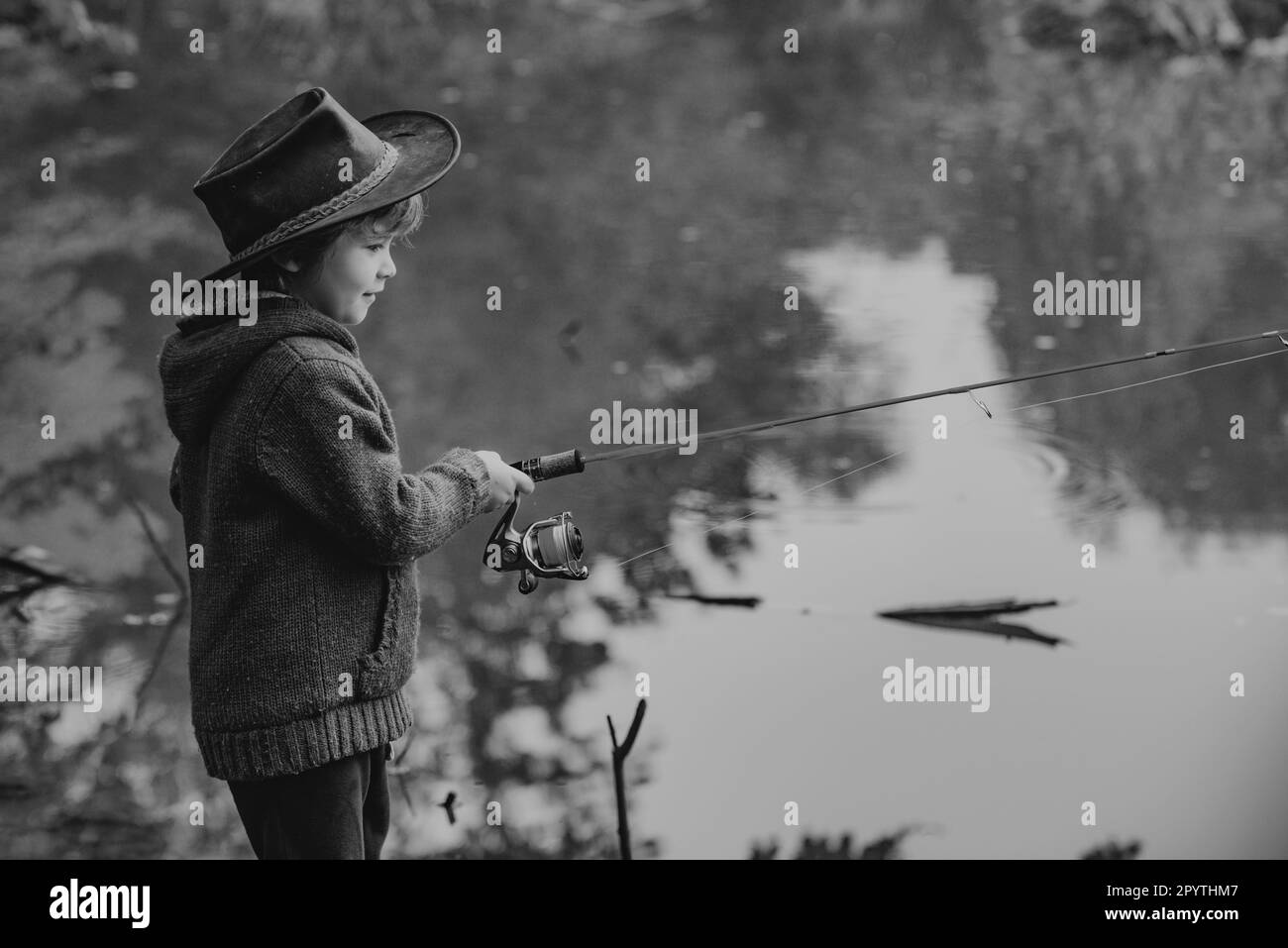 Portrait of cute kid little boy fishing Stock Photo - Alamy