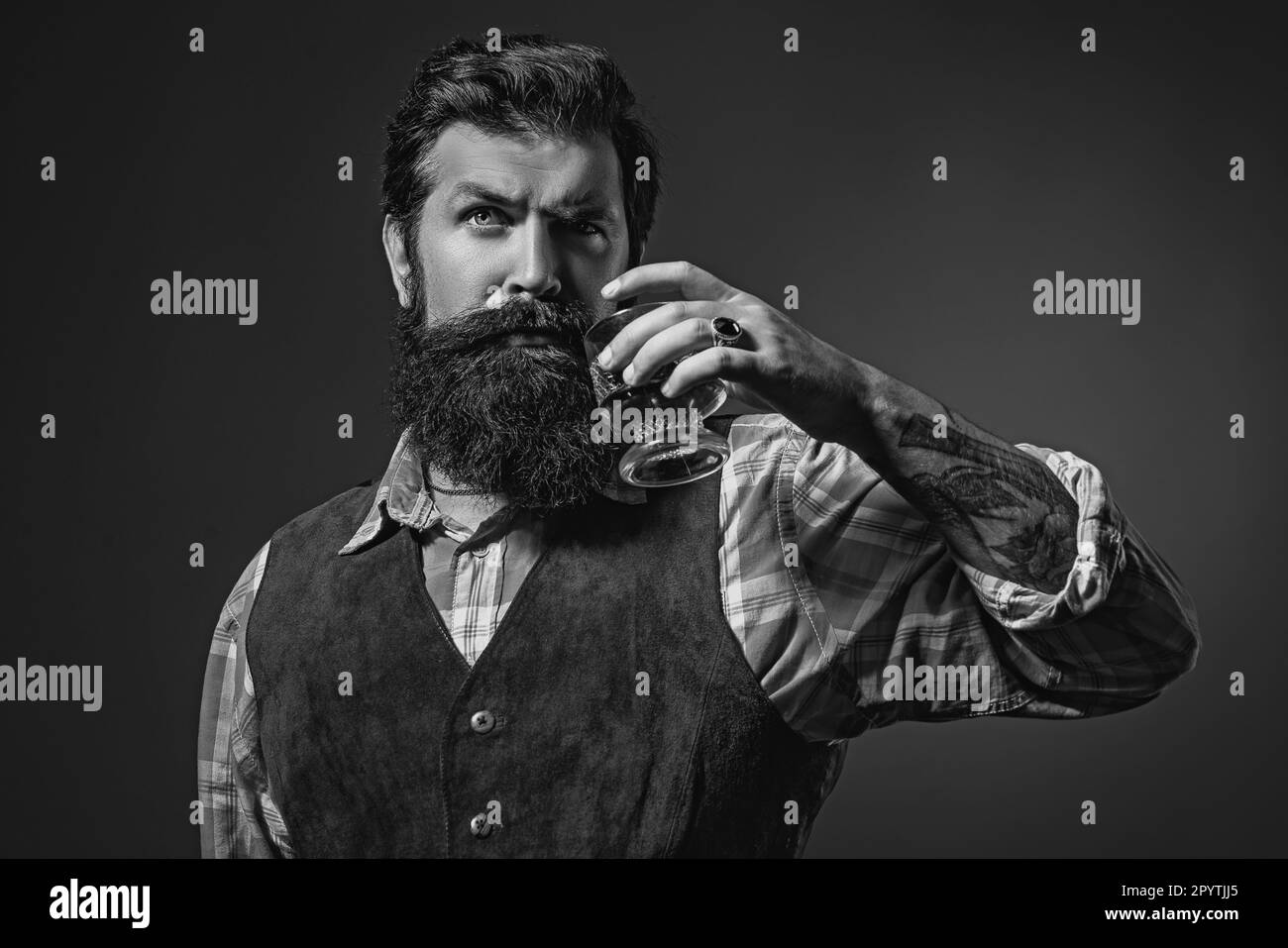 Whiskey. Fashionable man in white shirt and suspenders. Luxury beverage ...