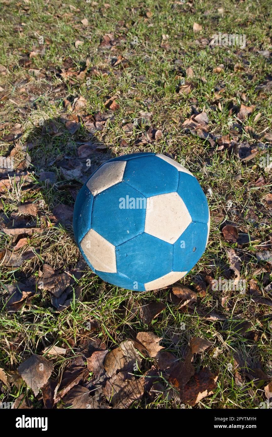 soccer ball on ground Stock Photo - Alamy