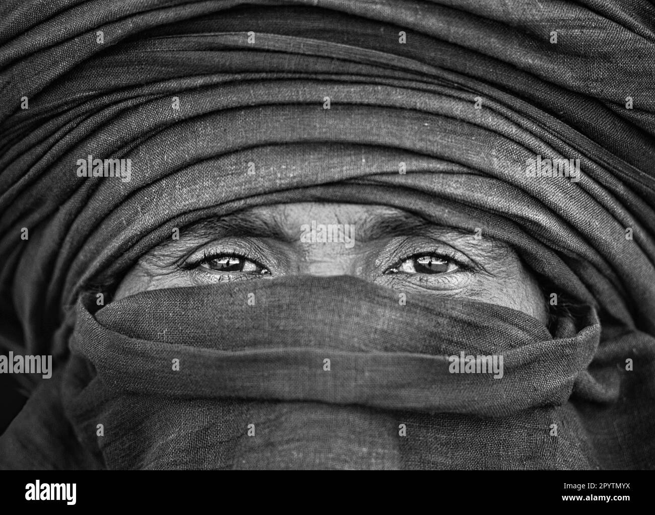 Algeria, near Djanet. Sahara desert. Man of Tuareg tribe. Portrait ...