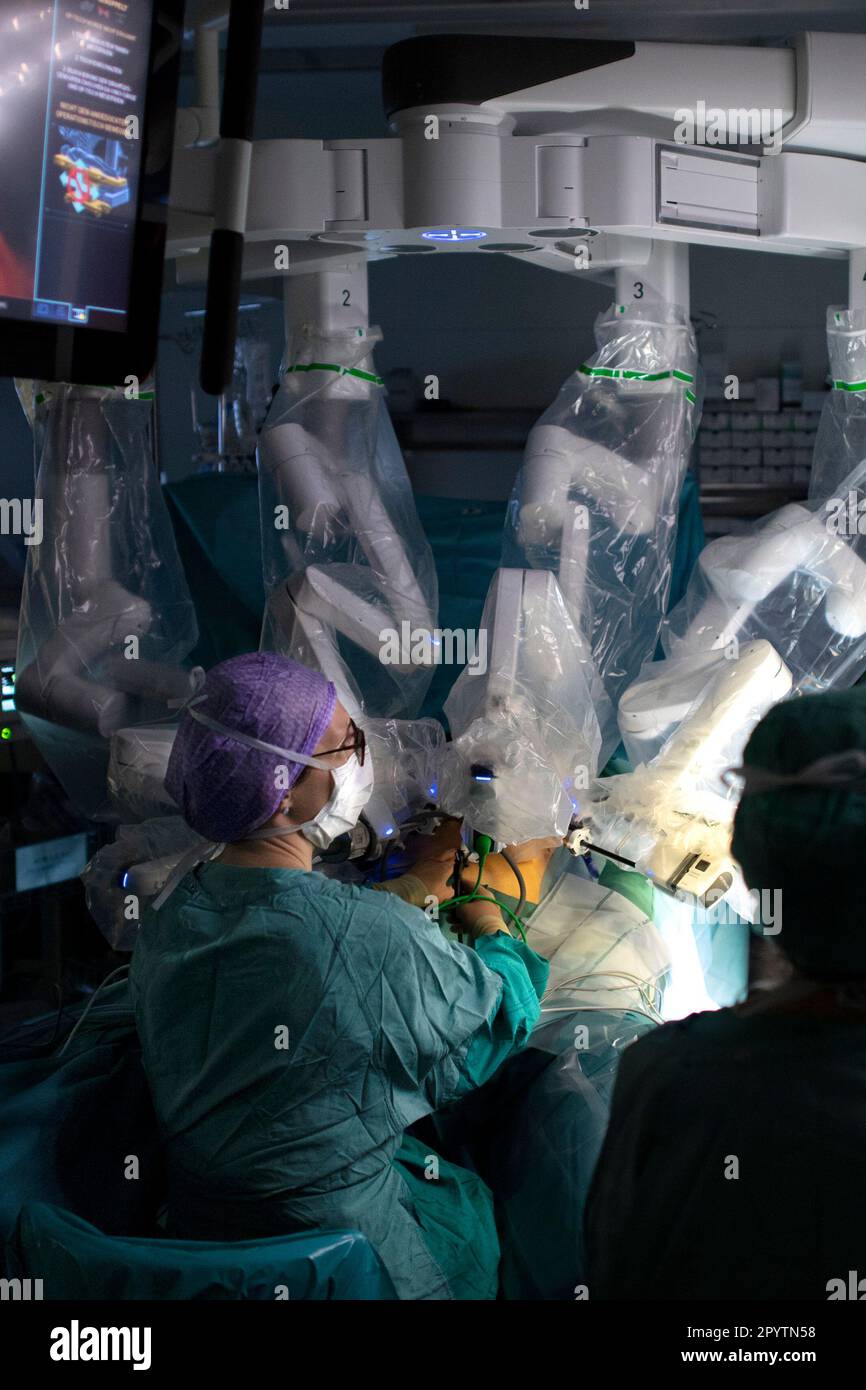 Doctor assists during a modern hybrid surgery, 3D innovative technology ...
