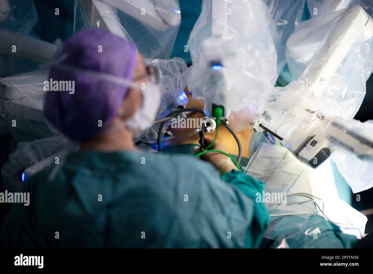 Doctor assists during a modern hybrid surgery, 3D innovative technology ...