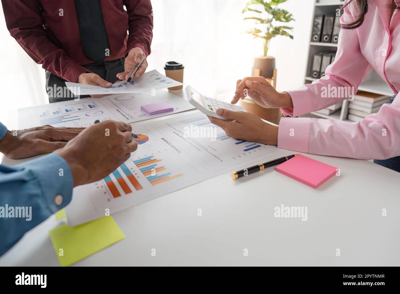 Business team analyzing income charts and graphs. Close up business ...
