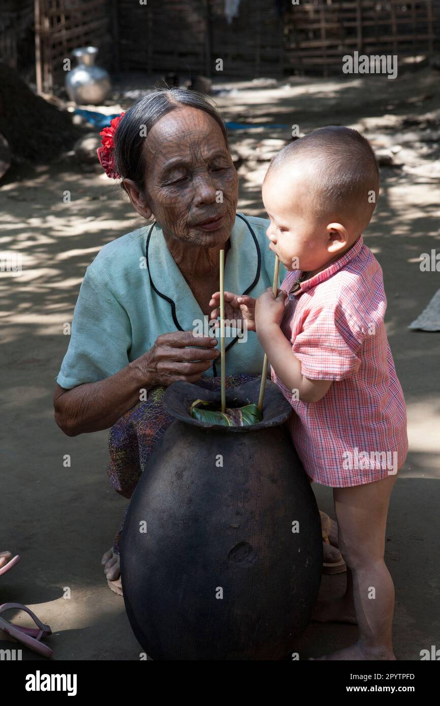 First drink with grandma Stock Photo - Alamy
