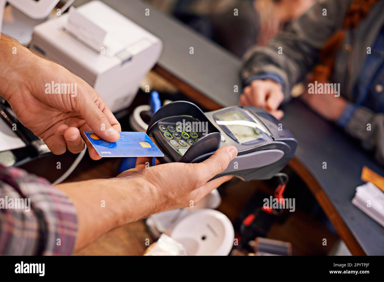Credit card, shopping and customer at a cafe or cashier hands or debit ...