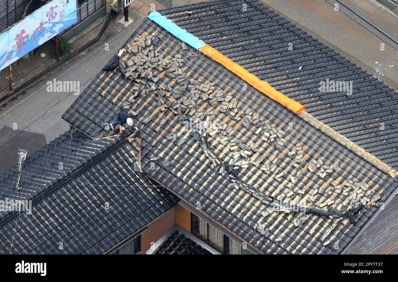 An aerial photo shows roof tiles of collapsed house caused by massive ...