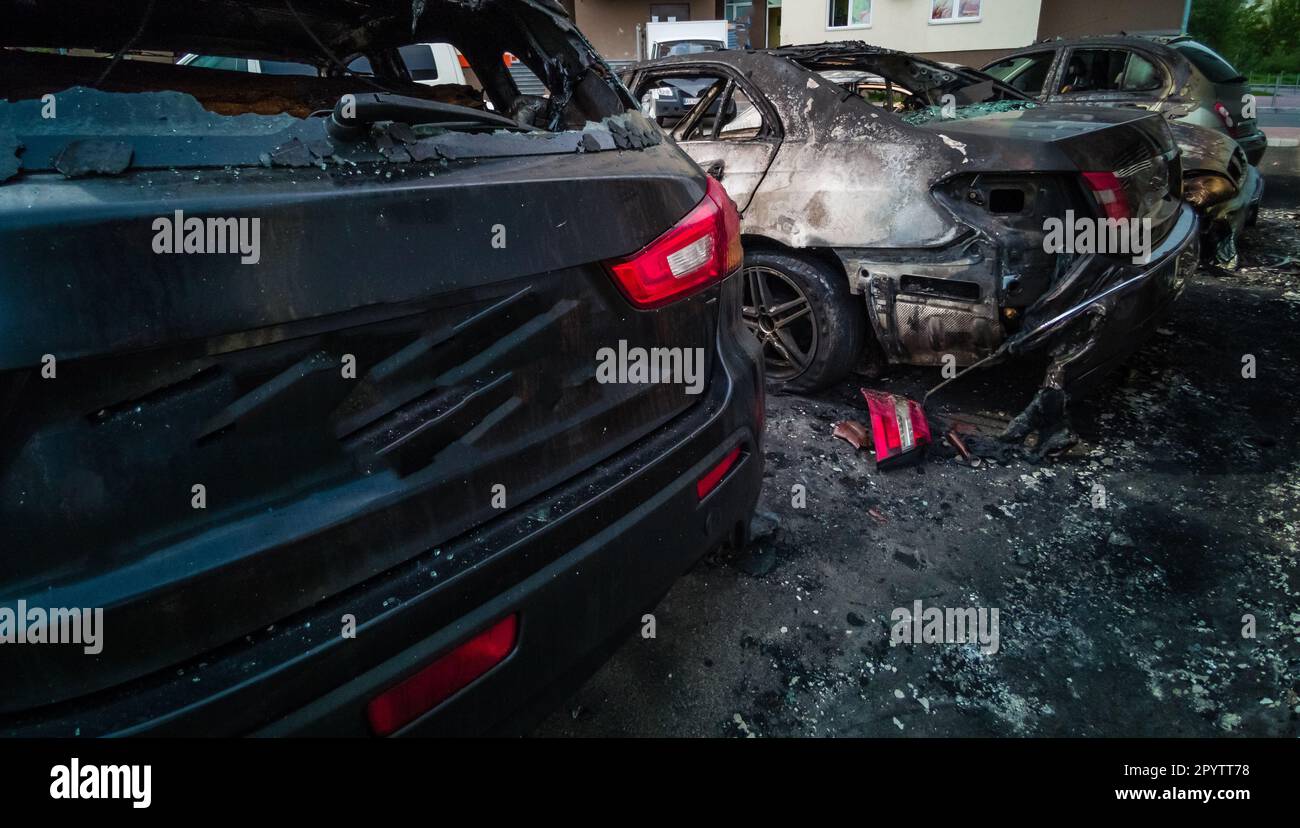 Broken and burned cars in the parking lot, accident or deliberate ...