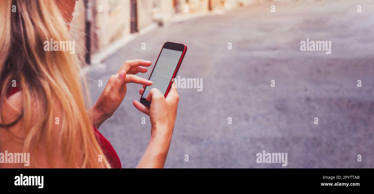 female hands using smartphone, banner background with copy space ...
