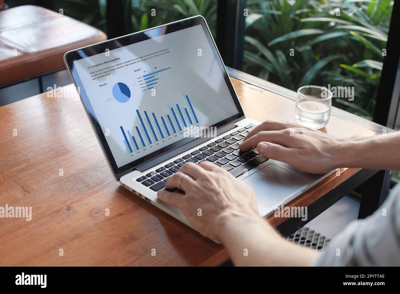 data analytics, business man looking at financial charts on the screen ...
