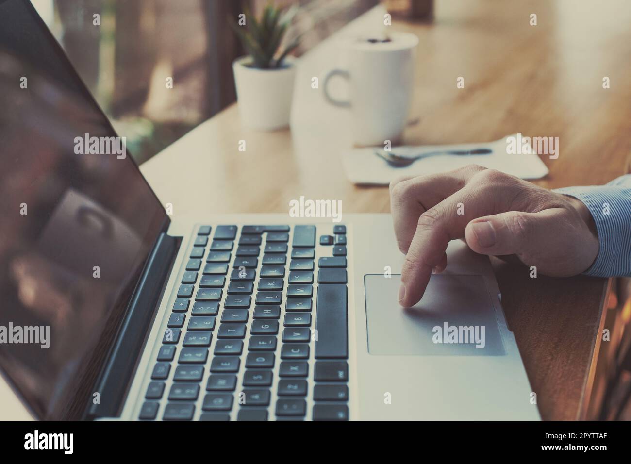 hand using wi-fi internet on computer, reading email, online banking ...