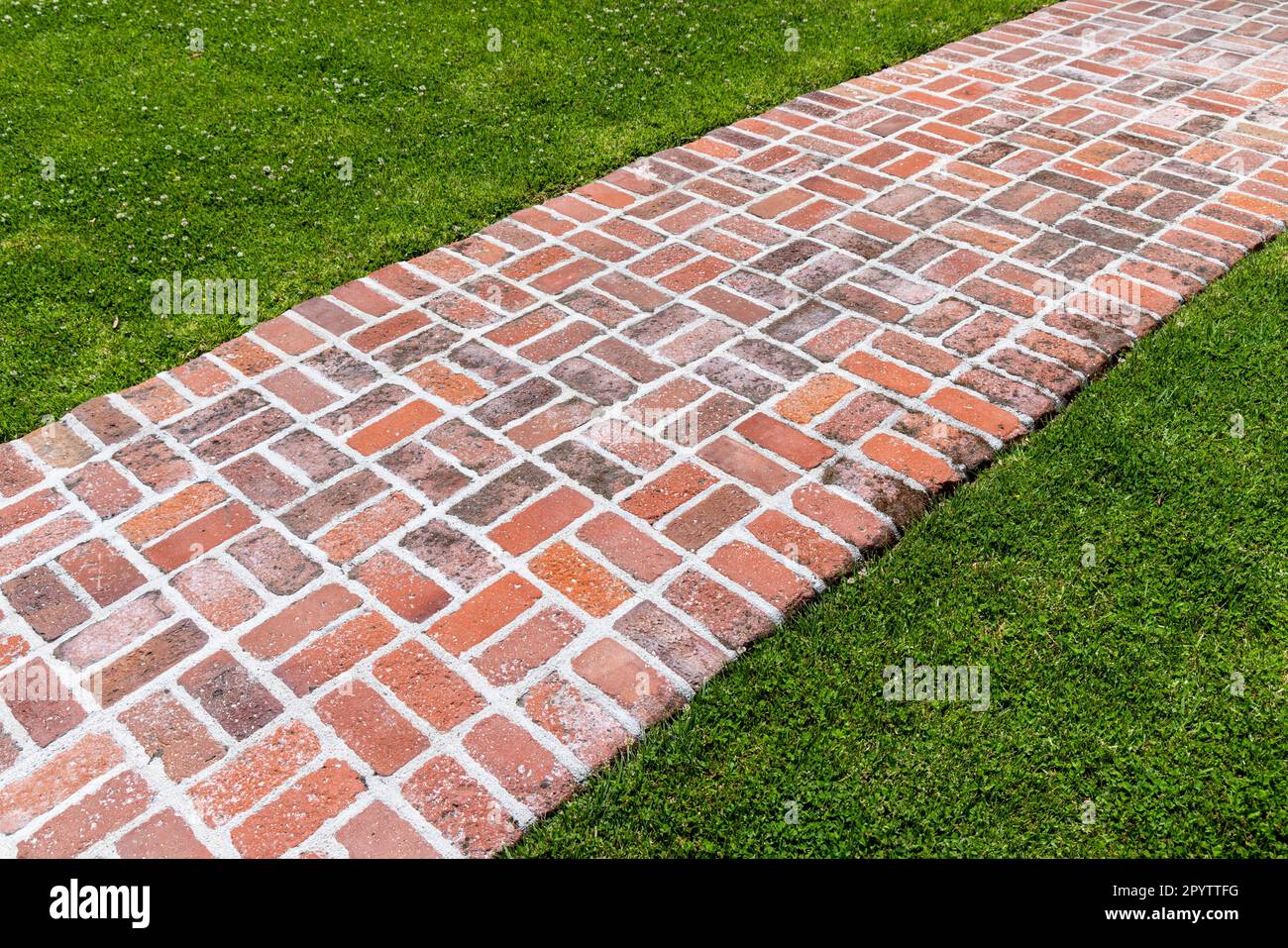 Texture and detail of a brick footpath. Wallpaper or stone backdrop ...