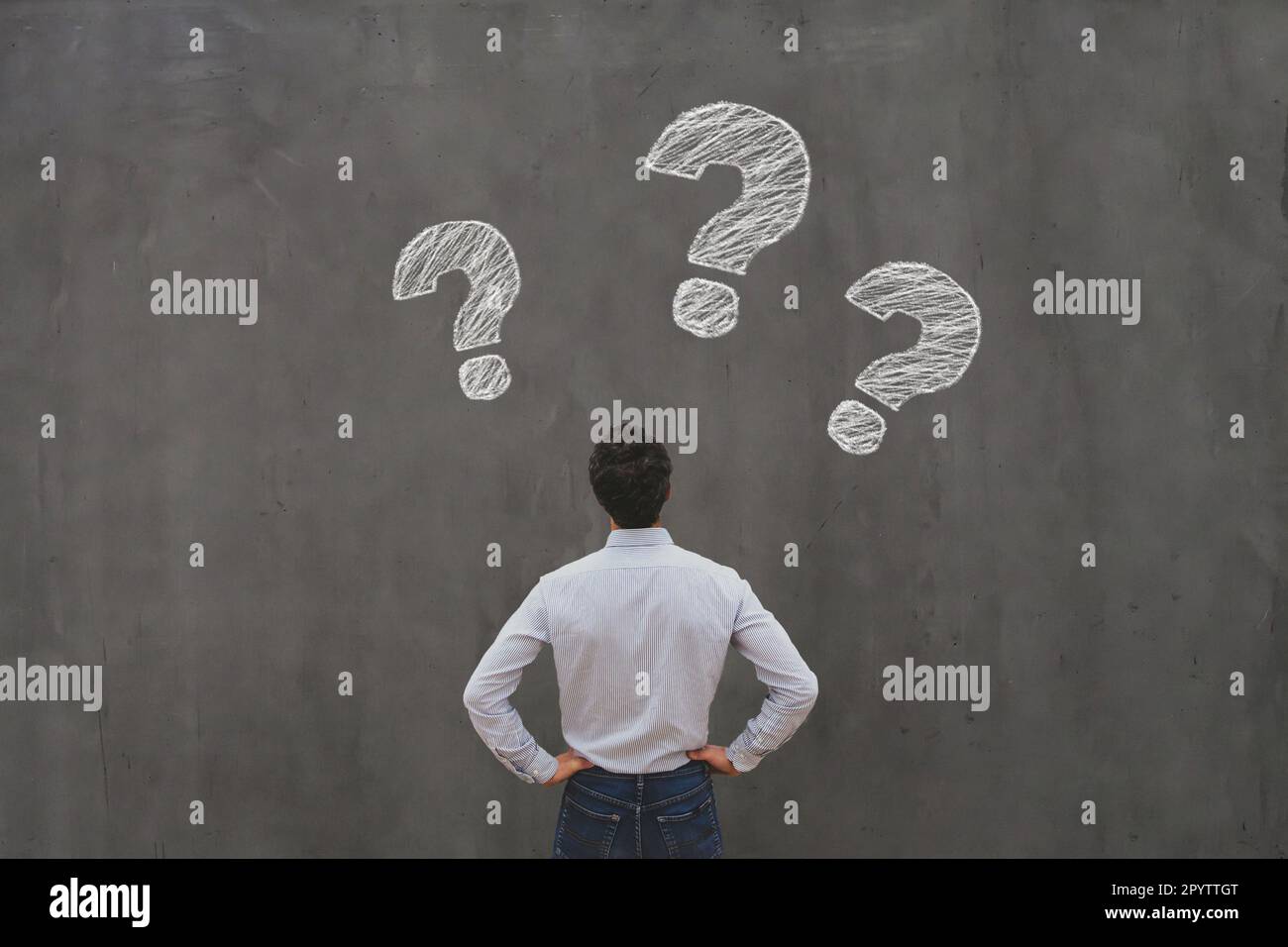 questions, business man looking at interrogation marks, why what where ...