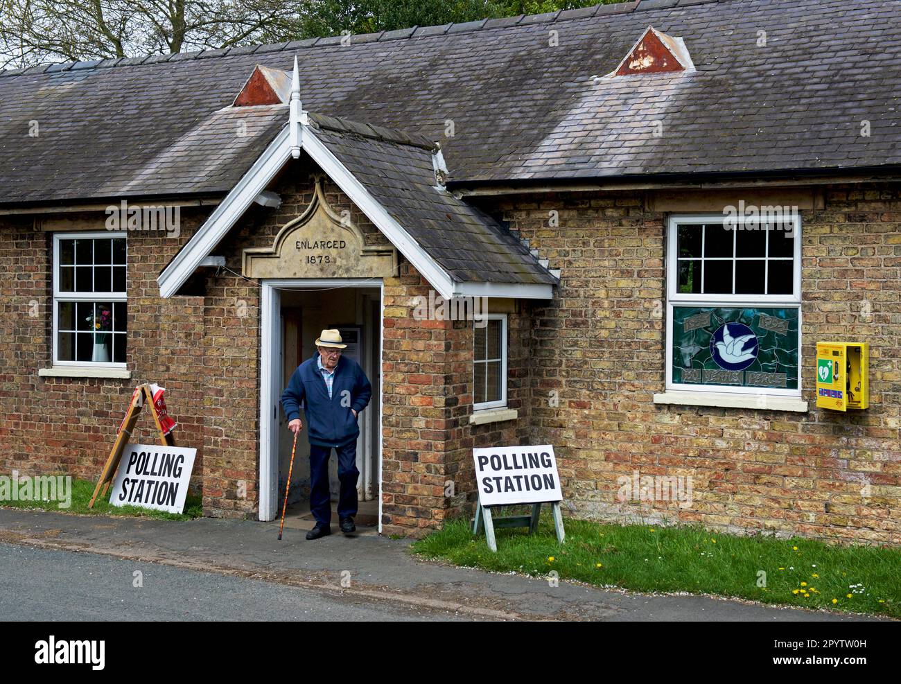 Senior man leaving polling station in the village hall, Blacktoft, East ...