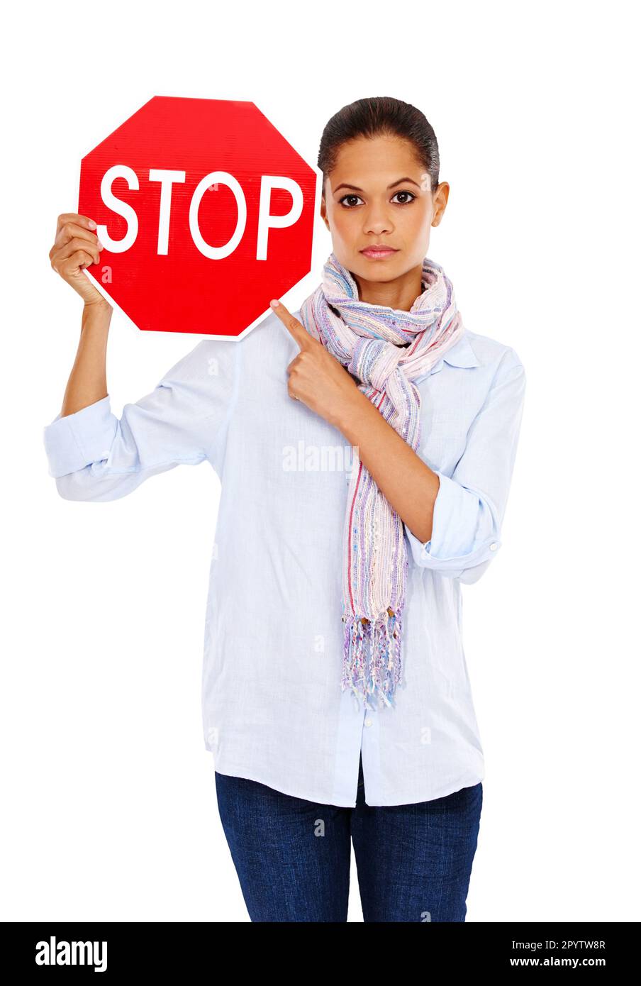 Portrait, woman and pointing to traffic stop sign on isolated ...