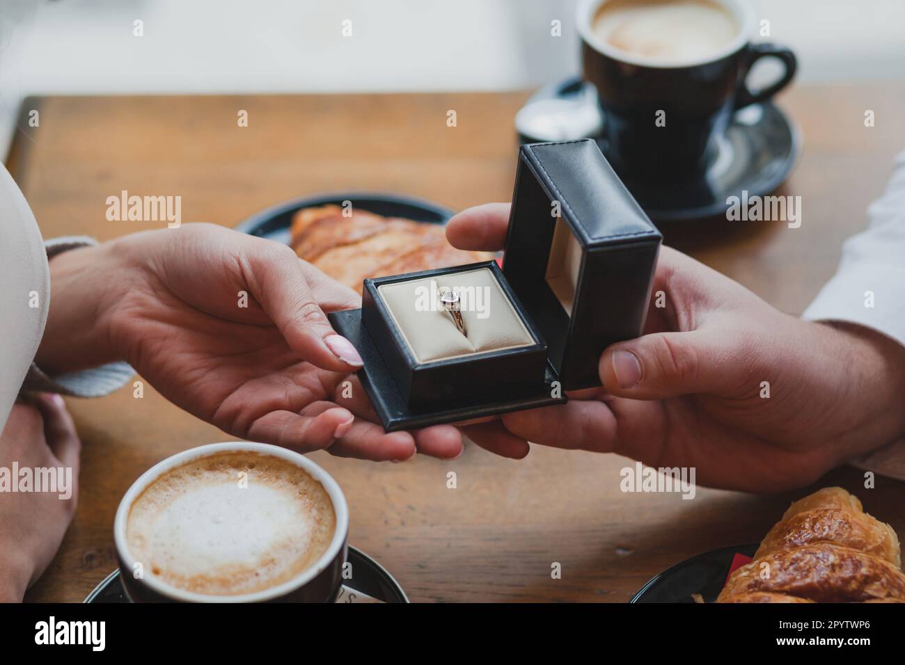 marriage proposal, hands holding engagement ring in a box, marry me ...