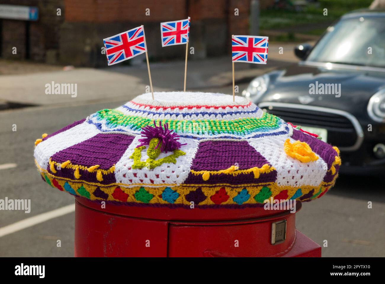 Twickenham, London. UK. 5 May 2023. Coronation Crown knitted hat topper ...