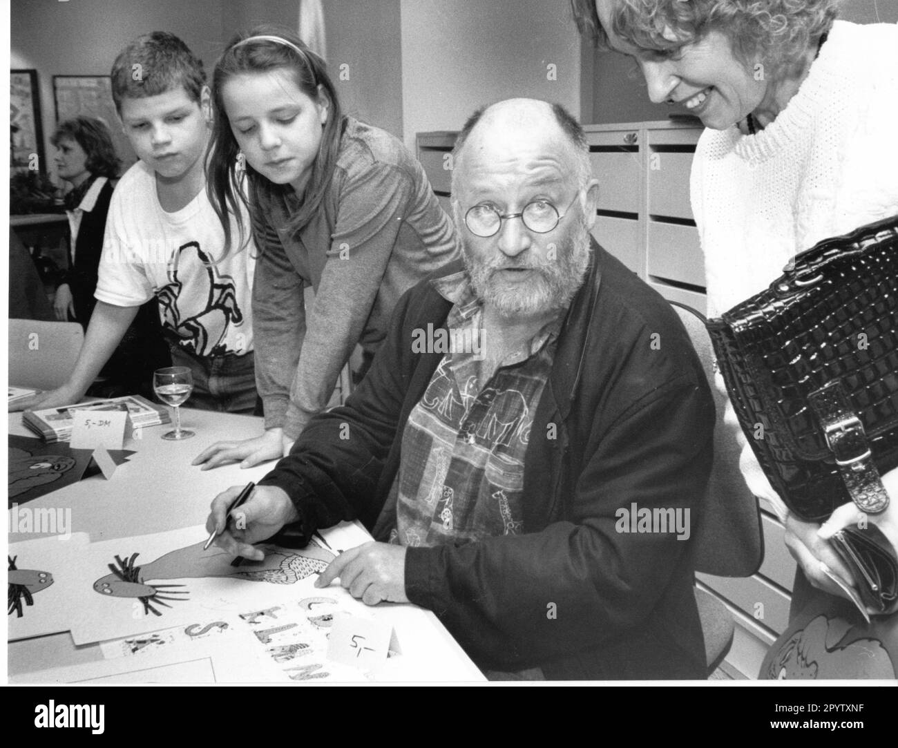 "Graphic artist and caricaturist Manfred Bofinger signs books and ...