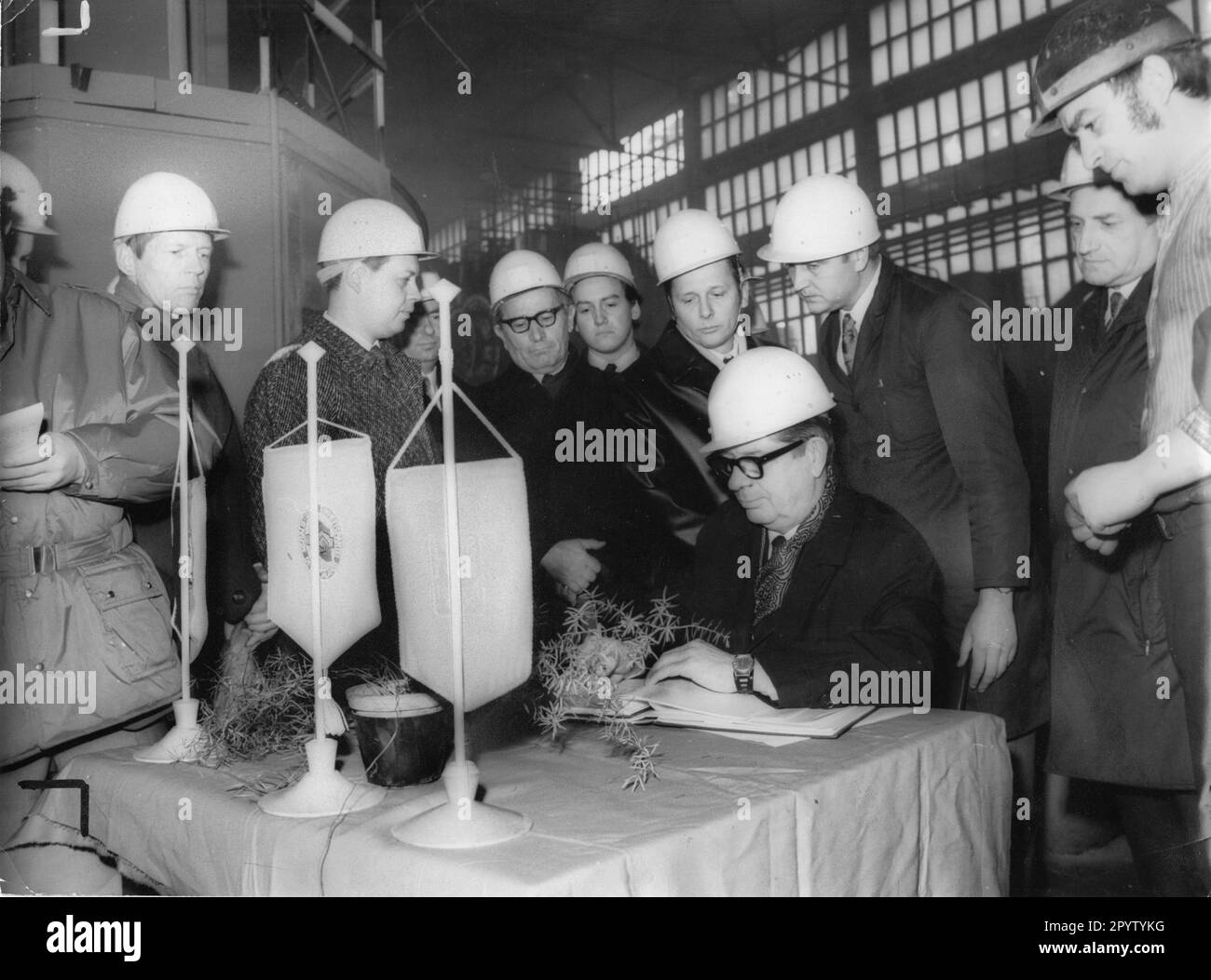 Aarne Saarinen, Chairman of the Communist Party of Finland, signs the ...