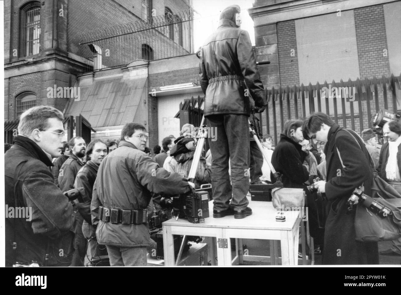 Journalists wait outside the main entrance of Moabit Prison in Berlin ...