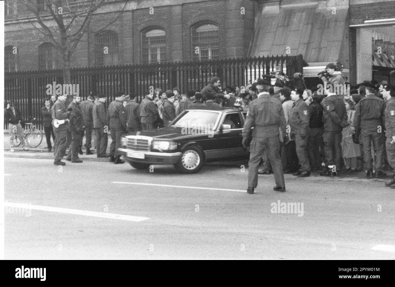 Journalists and police wait outside the main entrance of Moabit Prison ...