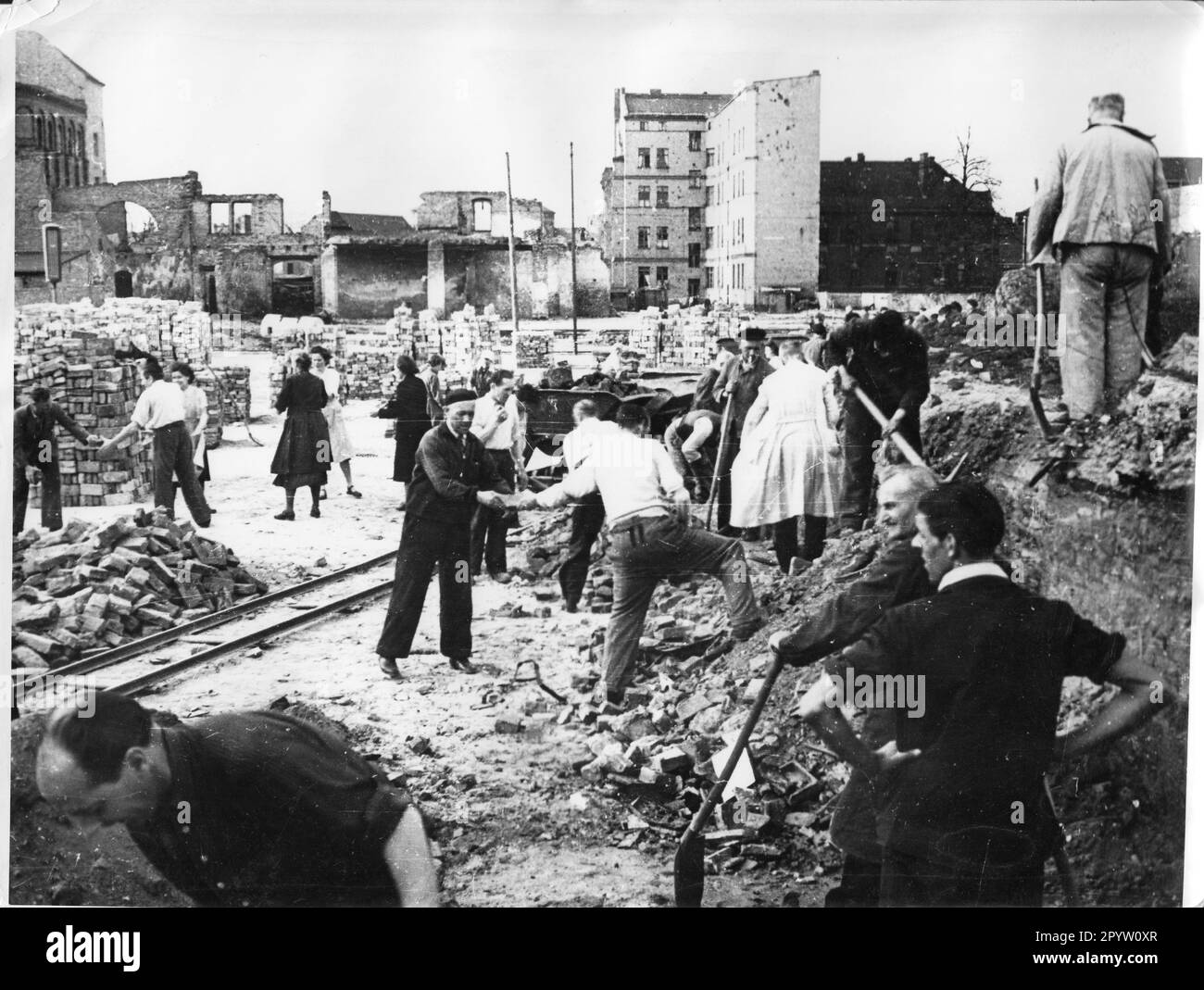 People clearing the rubble of war destruction in Potsdam.Debris removal ...