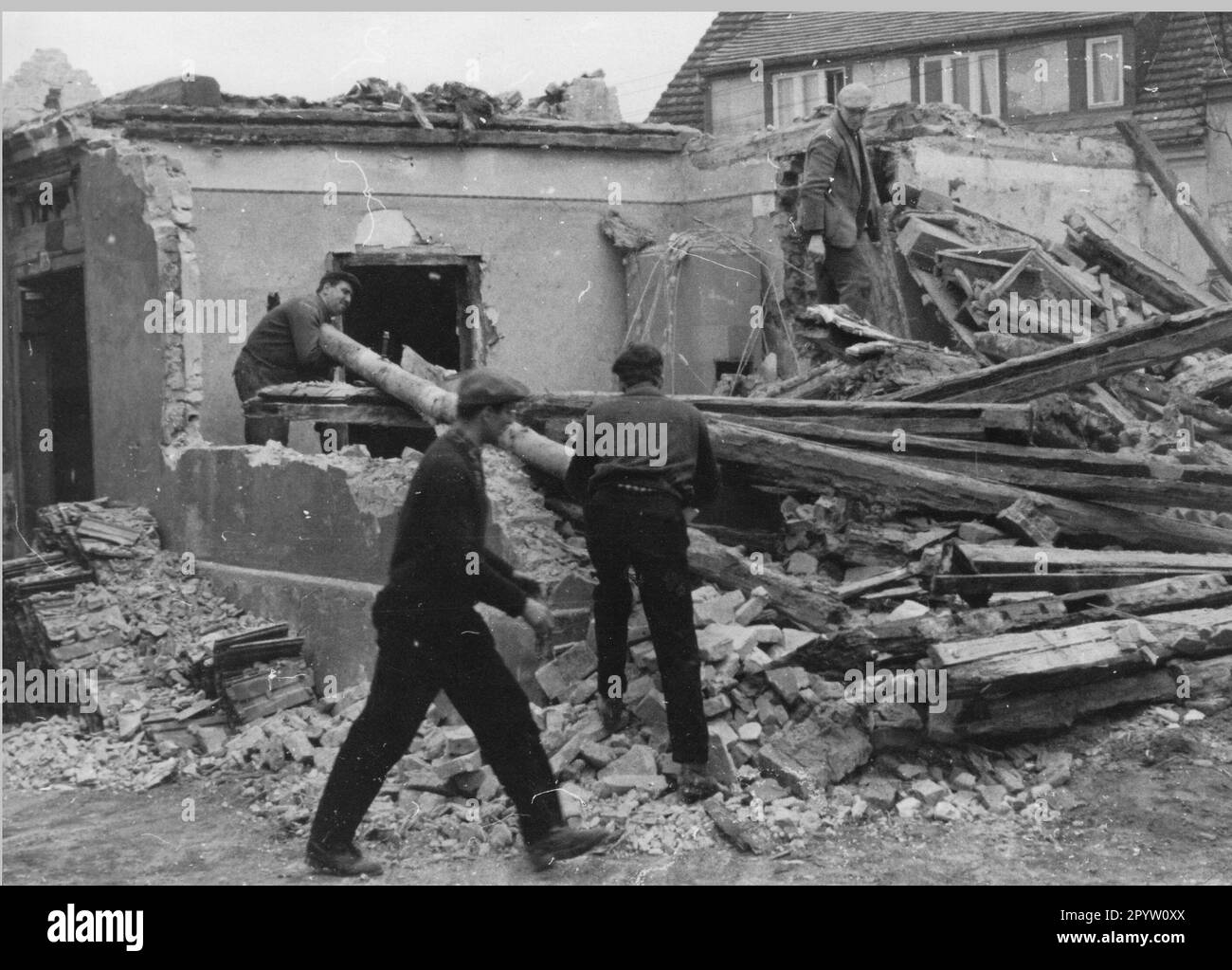 People clearing the rubble in Potsdam. War destruction. Photo:MAZ ...