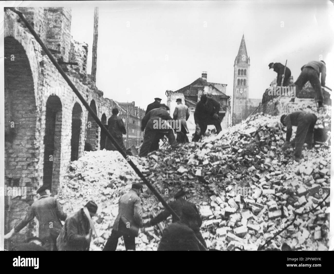 People clearing the rubble of war destruction in Potsdam.Debris removal ...