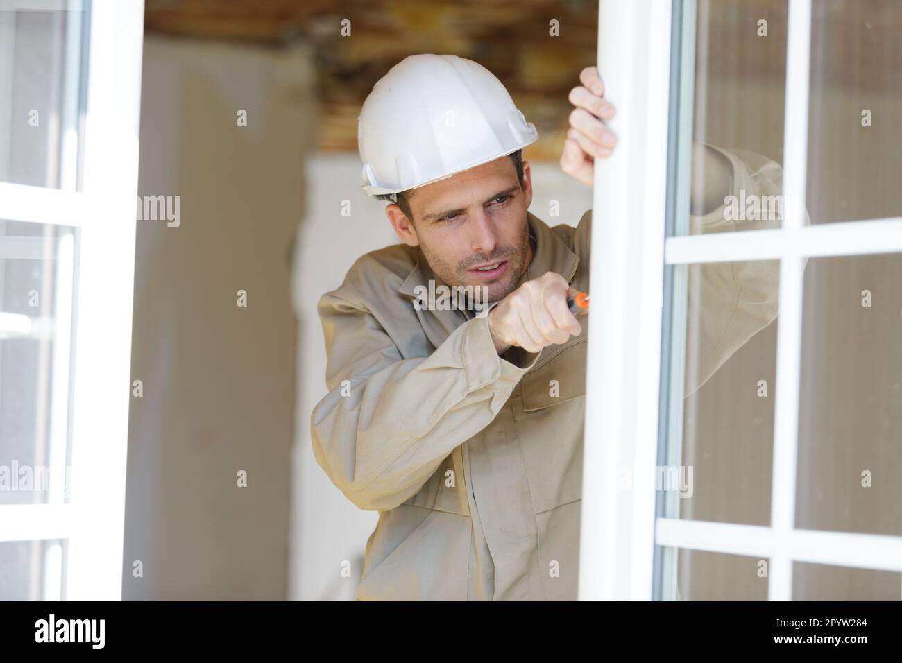 window installation process made by two construction workers Stock ...