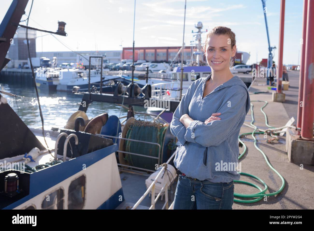female engineer working in a harbor background Stock Photo - Alamy