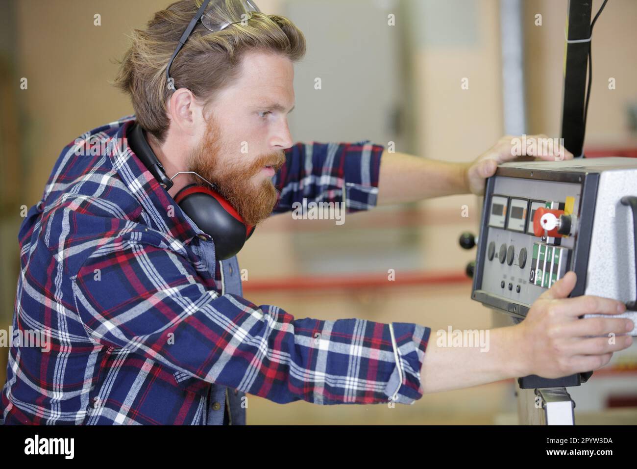 Man operating machines hi-res stock photography and images - Alamy