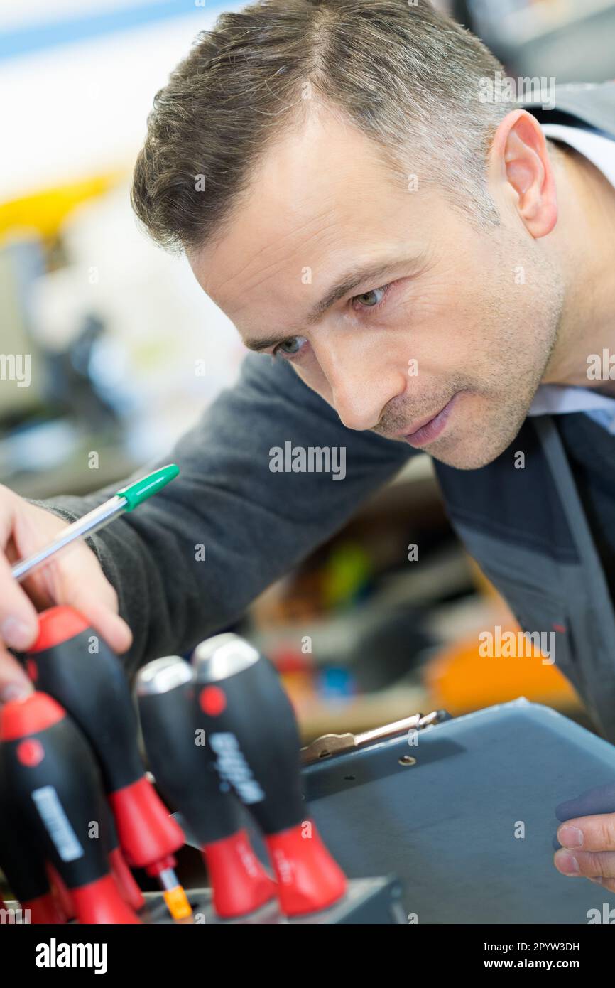 man working with tools equipment set Stock Photo - Alamy