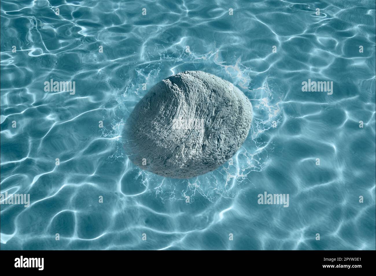 Close up pebble shaped driftwood splashing in shallow water Stock Photo ...
