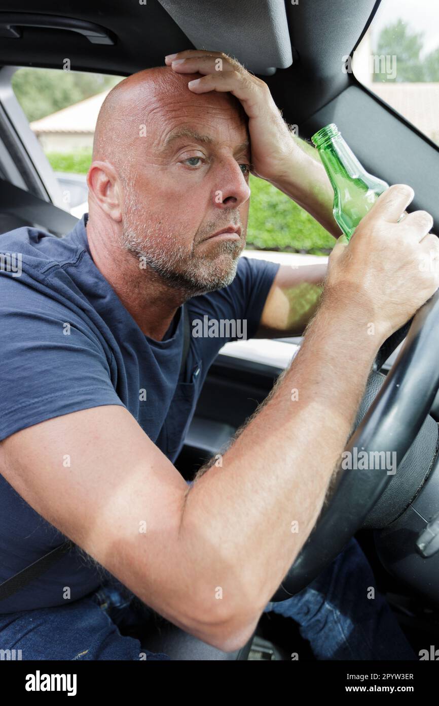 man drinking beer while driving in his car Stock Photo - Alamy