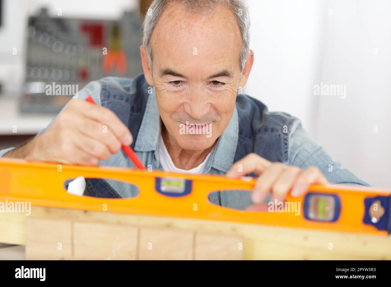 Man smoothing timber hi-res stock photography and images - Alamy
