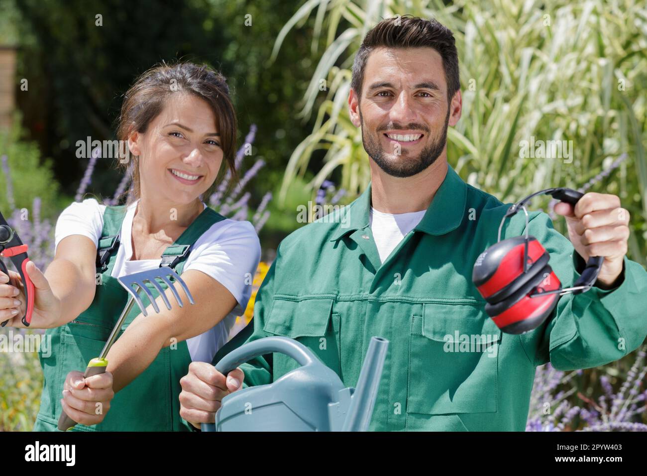 portrait of landscape gardening team holding tools of the trade Stock ...