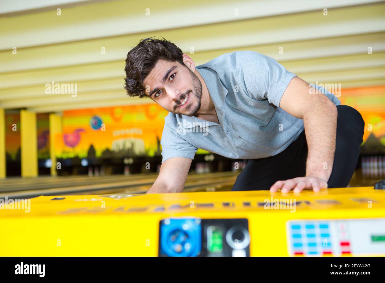 handsome man bowling in club and throwing ball Stock Photo - Alamy