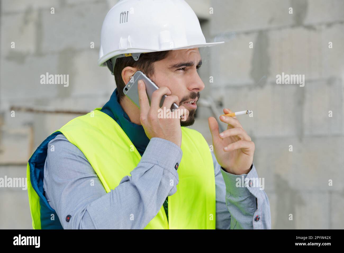 Construction worker smokes cigarette hi-res stock photography and ...