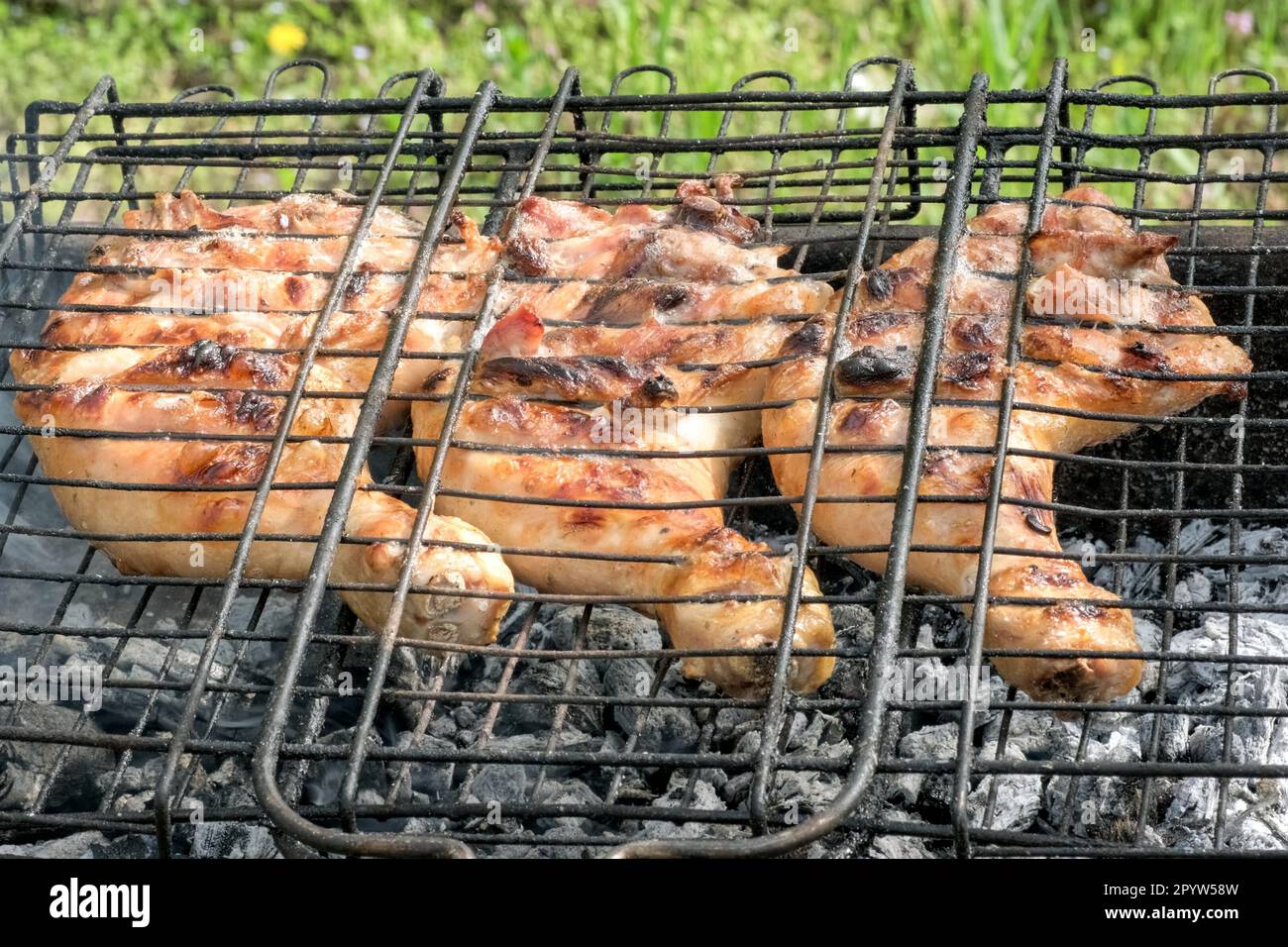 Chicken legs on grill grid. Delicious steak, hot barbecue Roasted ...