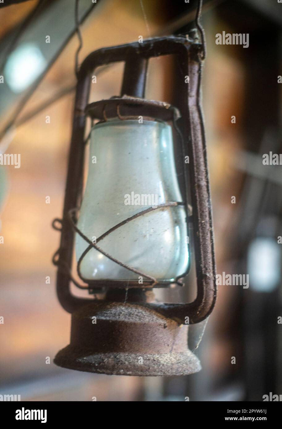 An old lantern hanging in a barn Stock Photo - Alamy