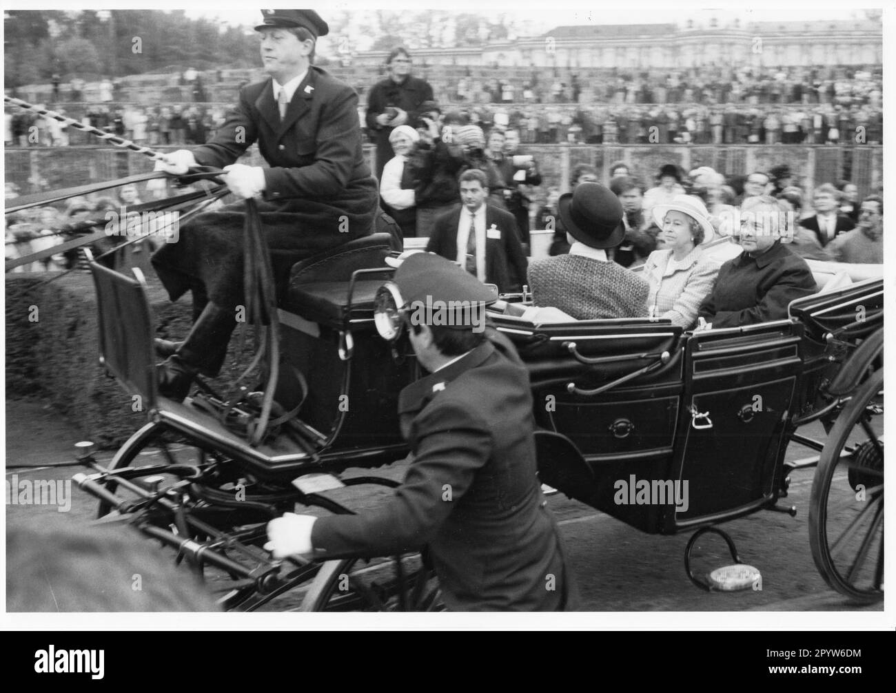 Queen Elizabeth II of England takes a carriage ride in Sanssouci Park ...